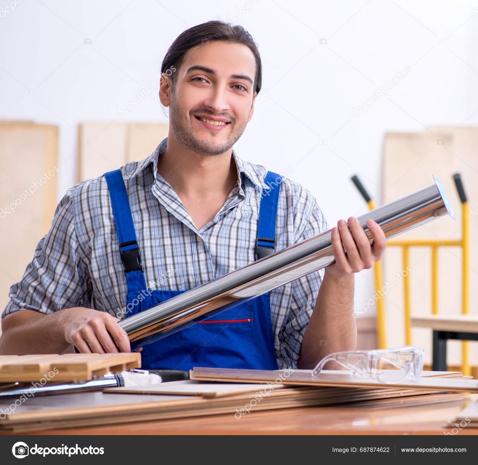 Young Male Carpenter Working Indoors — Stock Photo © Elnur_ #687874622 Young Male Carpenter Working Indoors — Stock Photo © Elnur_ #687874622