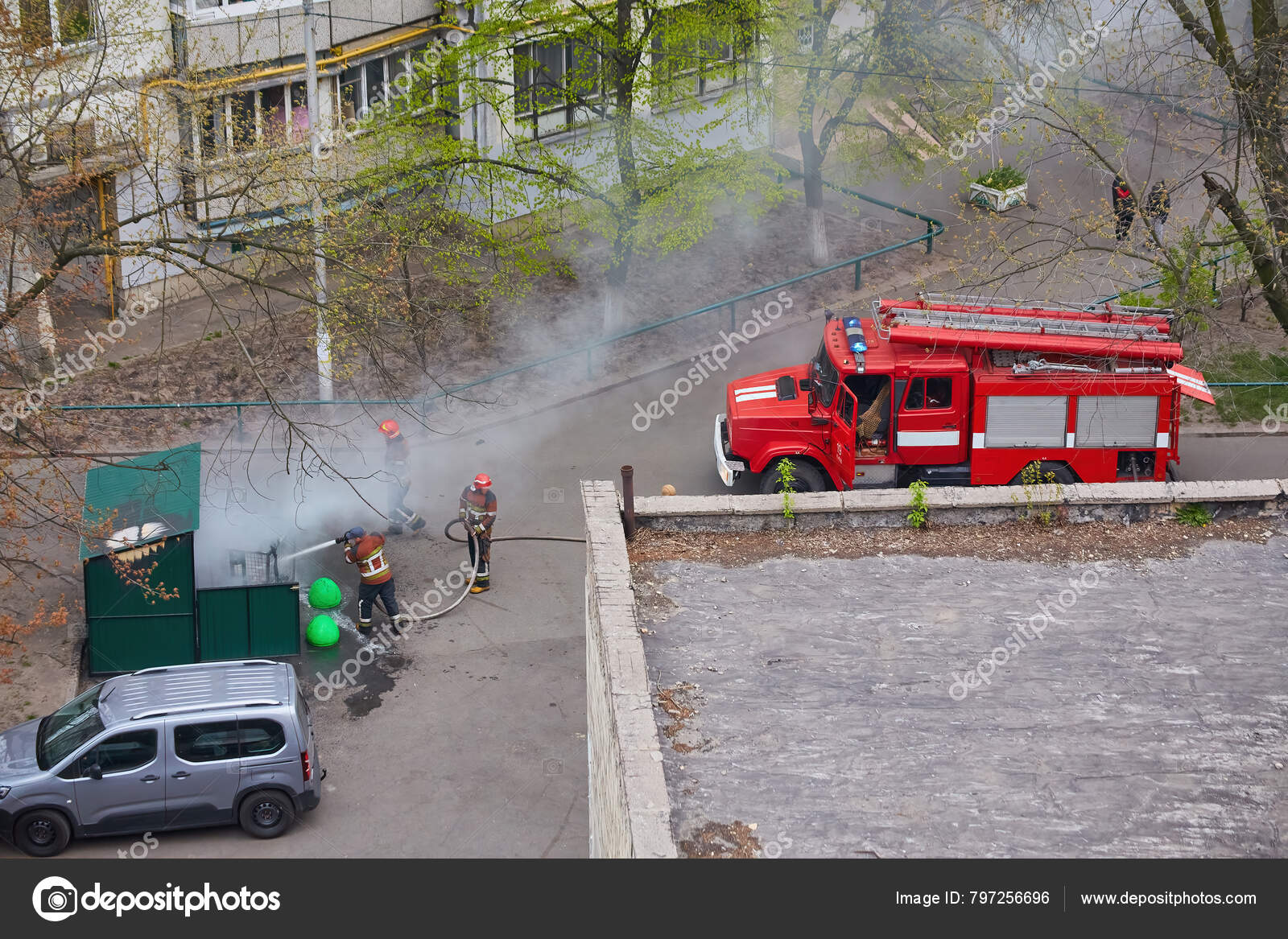 Team Firefighters Extinguishing Fire Residential Area Red Fire Truck ...