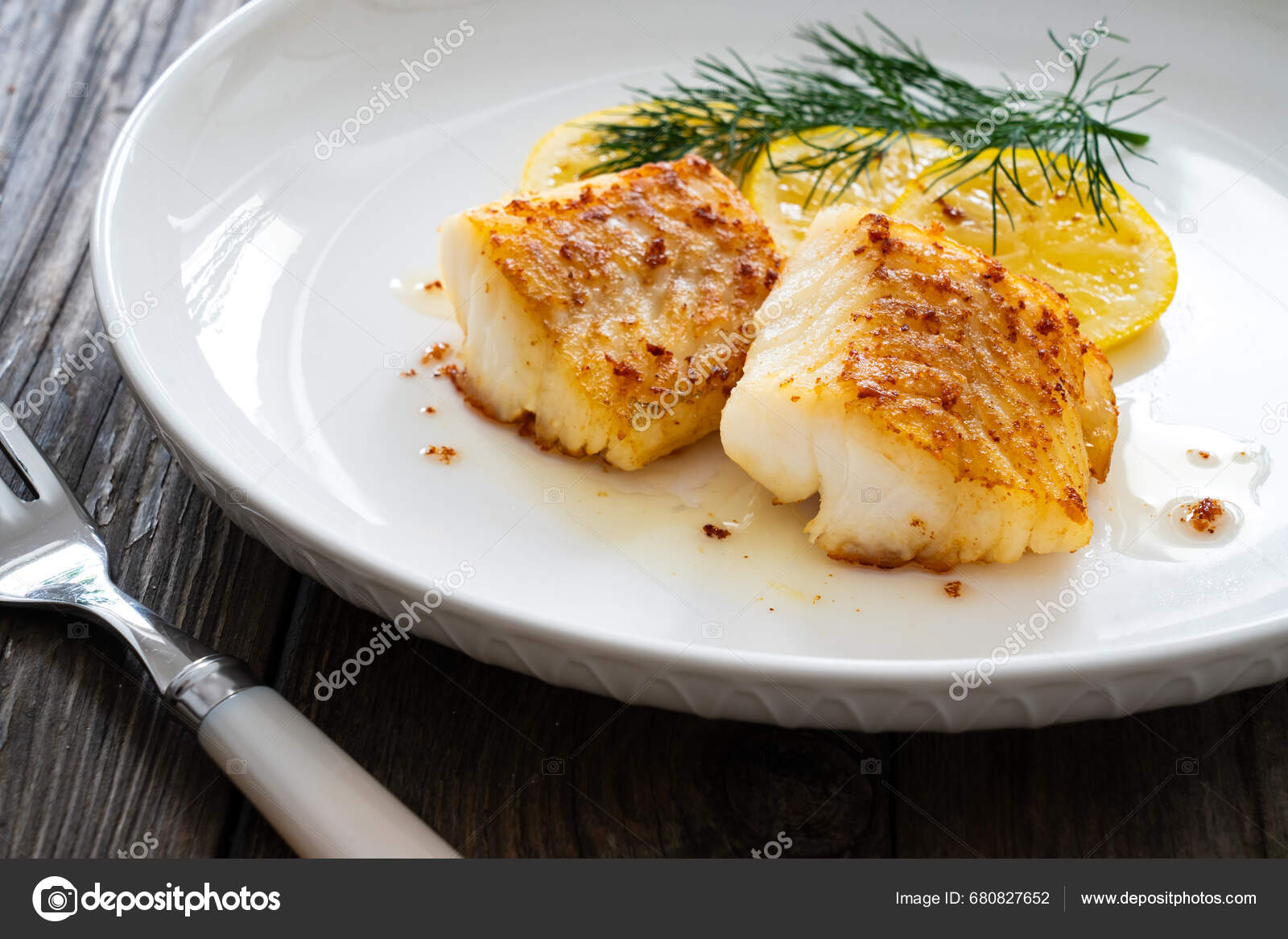 Seared Cod Loin Sliced Lemon Wooden Table — Stock Photo © gbh007 #680827652