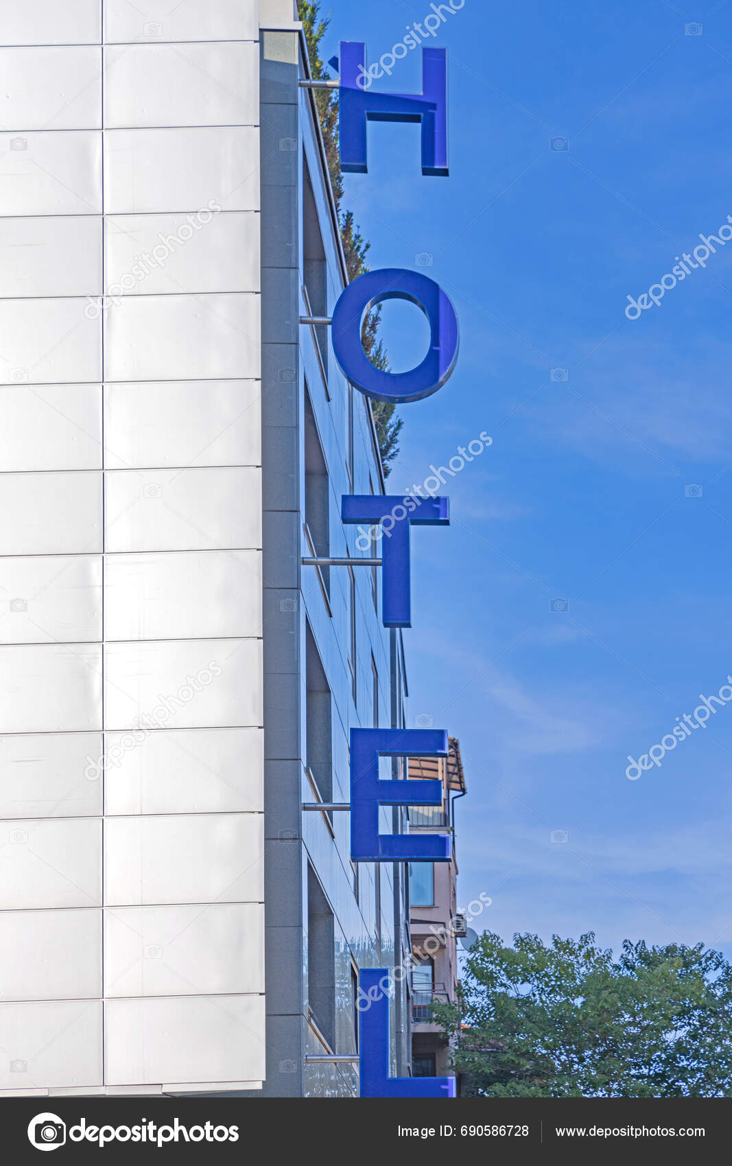 Vertical Blue Letters Hotel Sign Hanging Building Side — Stock Photo ...