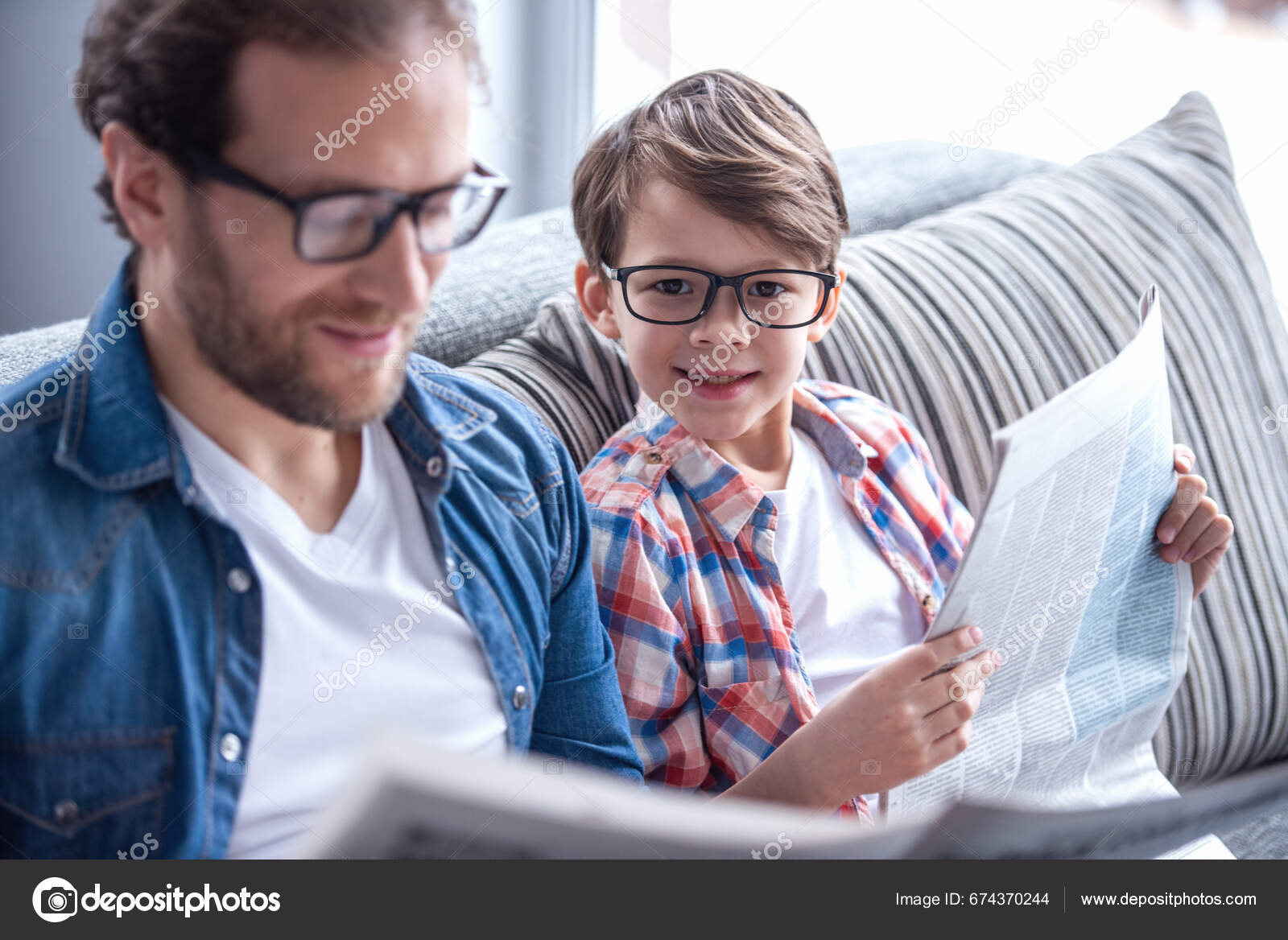 Father Son Reading Newspapers Smiling While Spending Time Together Home ...