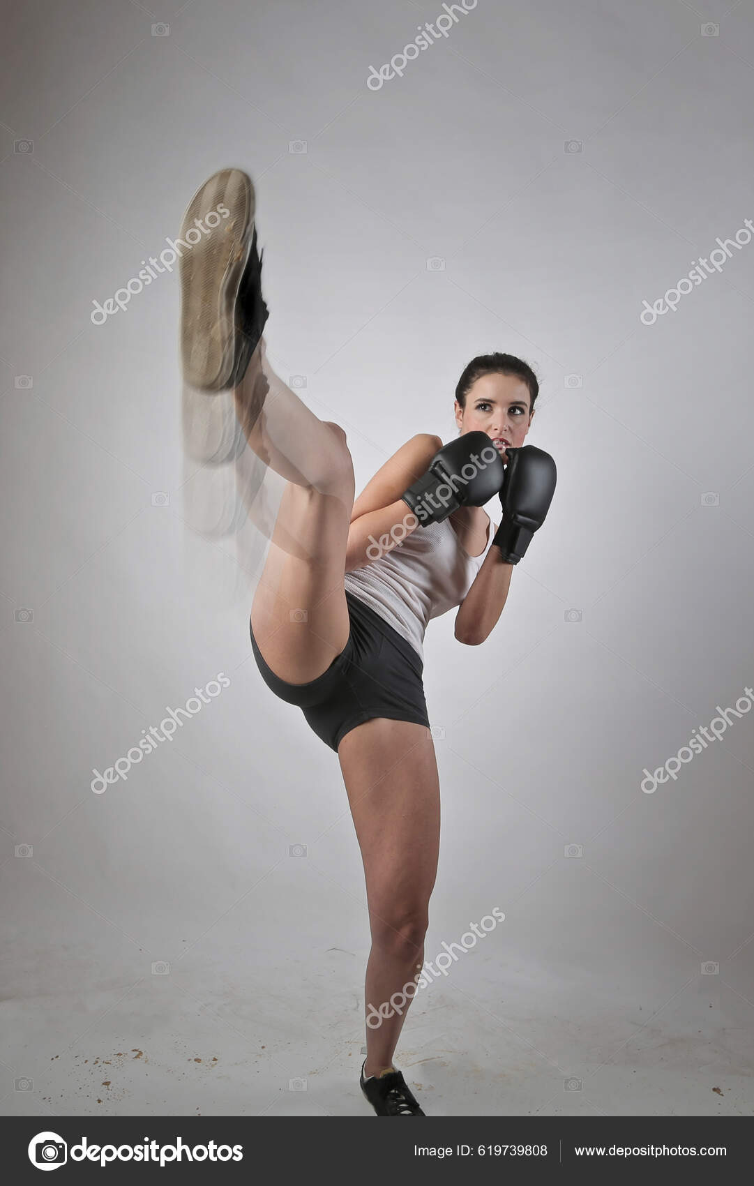 Young Woman Practicing Martial Arts — Stock Photo © olly18 #619739808