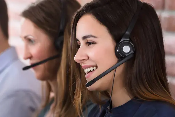 Positive Female Customer Services Agent With Headset Working In A Call Center - Stock Image ...