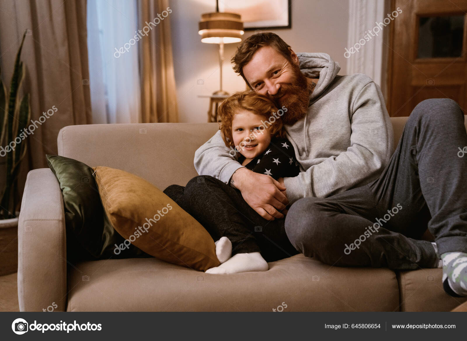 Ginger Father Son Hugging Smiling Camera While Resting Sofa Together ...