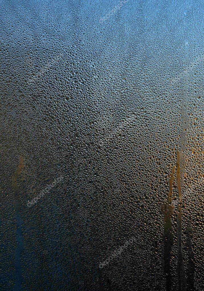 drops on the glass. Condensation on glass windows. vertical 2023