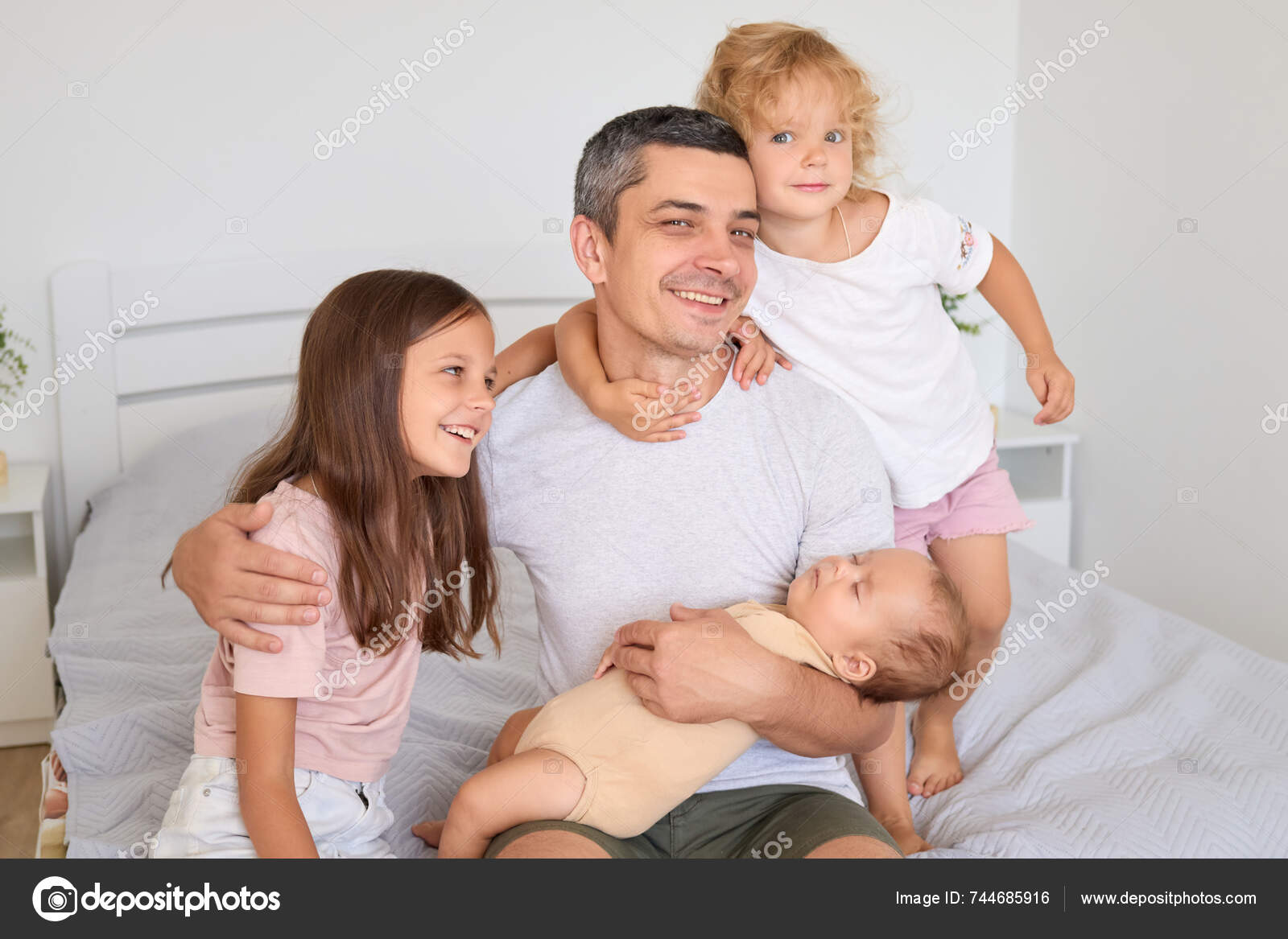 Overjoyed Satisfied Male Parent Daughters Tenderly Cuddling Infant Son ...