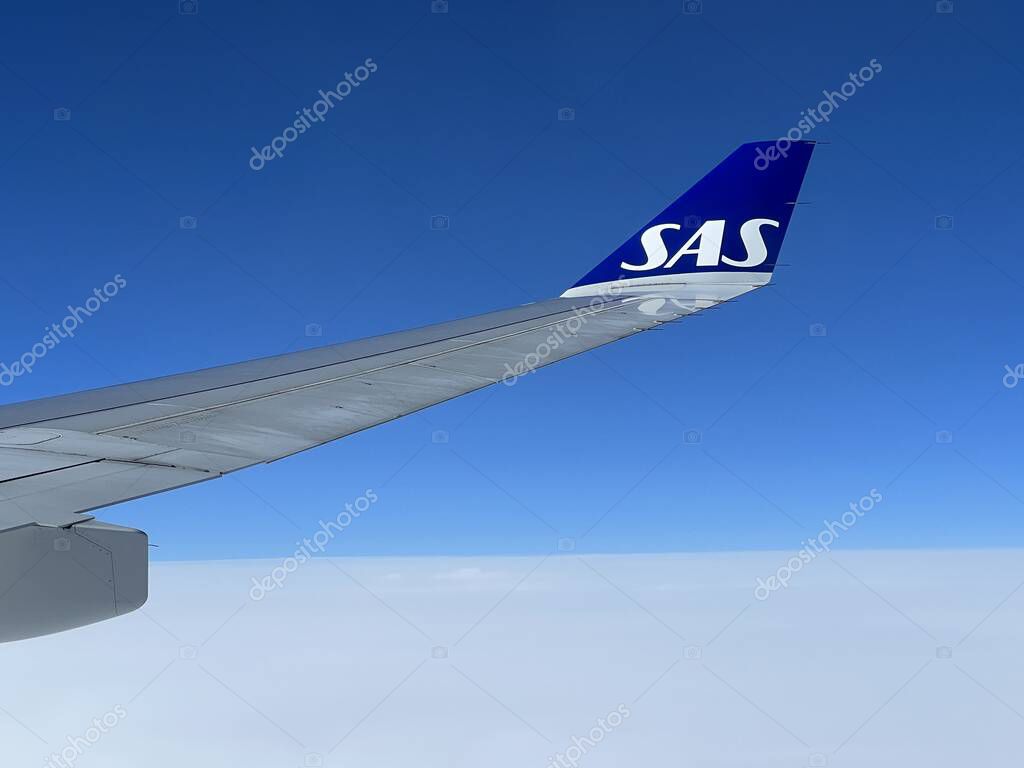 NEWARK, NJ - JUL 1: SAS Airlines airplane wing from aircraft window, as ...