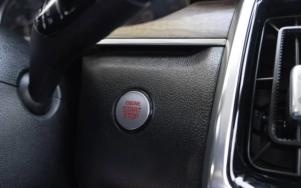Car dashboard with focus on engine start stop button. Modern car ...