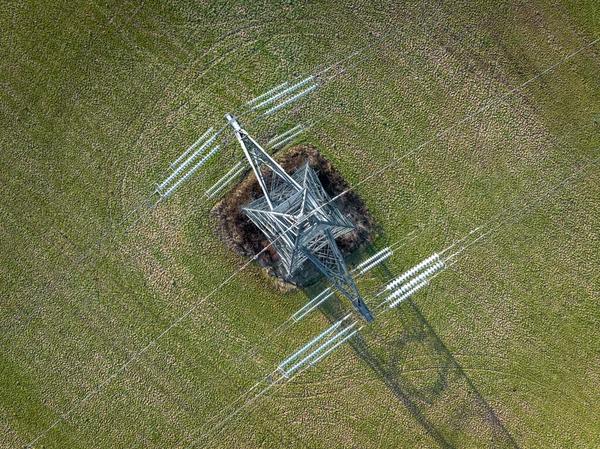 Bird's Eye View of Industrial High Voltage Lattice Power Line Tower 2024