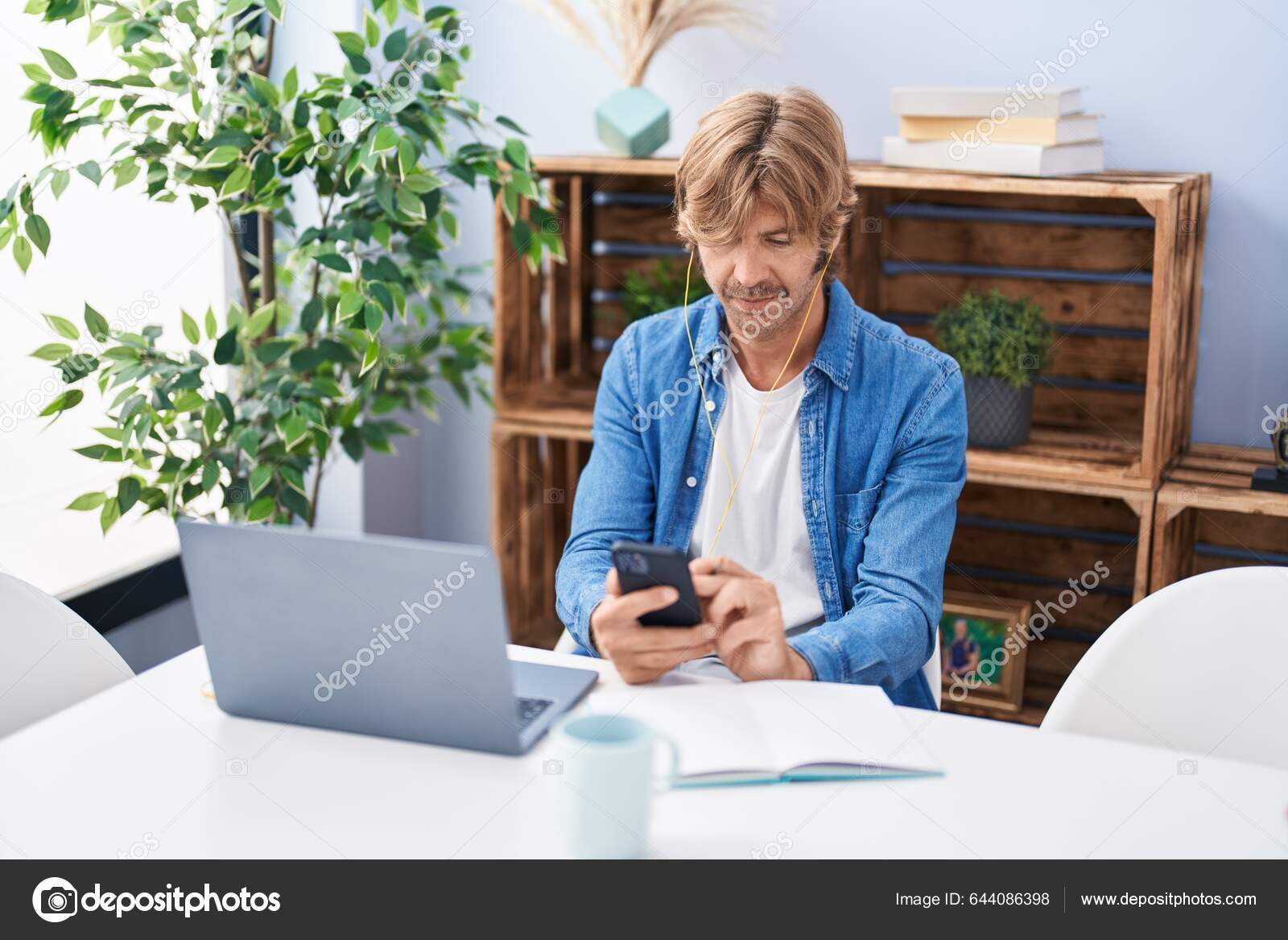 Young Man Sitting Table Using Smartphone Studying Home Stock Photo by ...