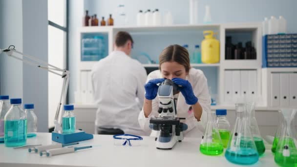 Young Couple Wearing Scientist Uniform Using Microscope Working ...