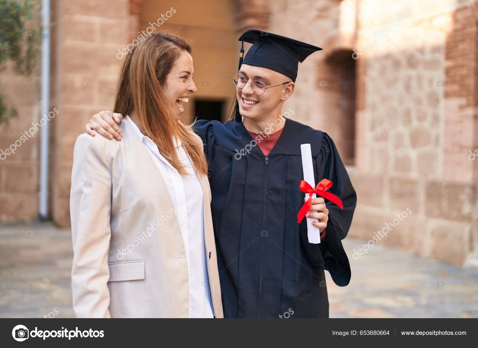 Man Woman Mother Son Hugging Each Other Celebrating Graduation