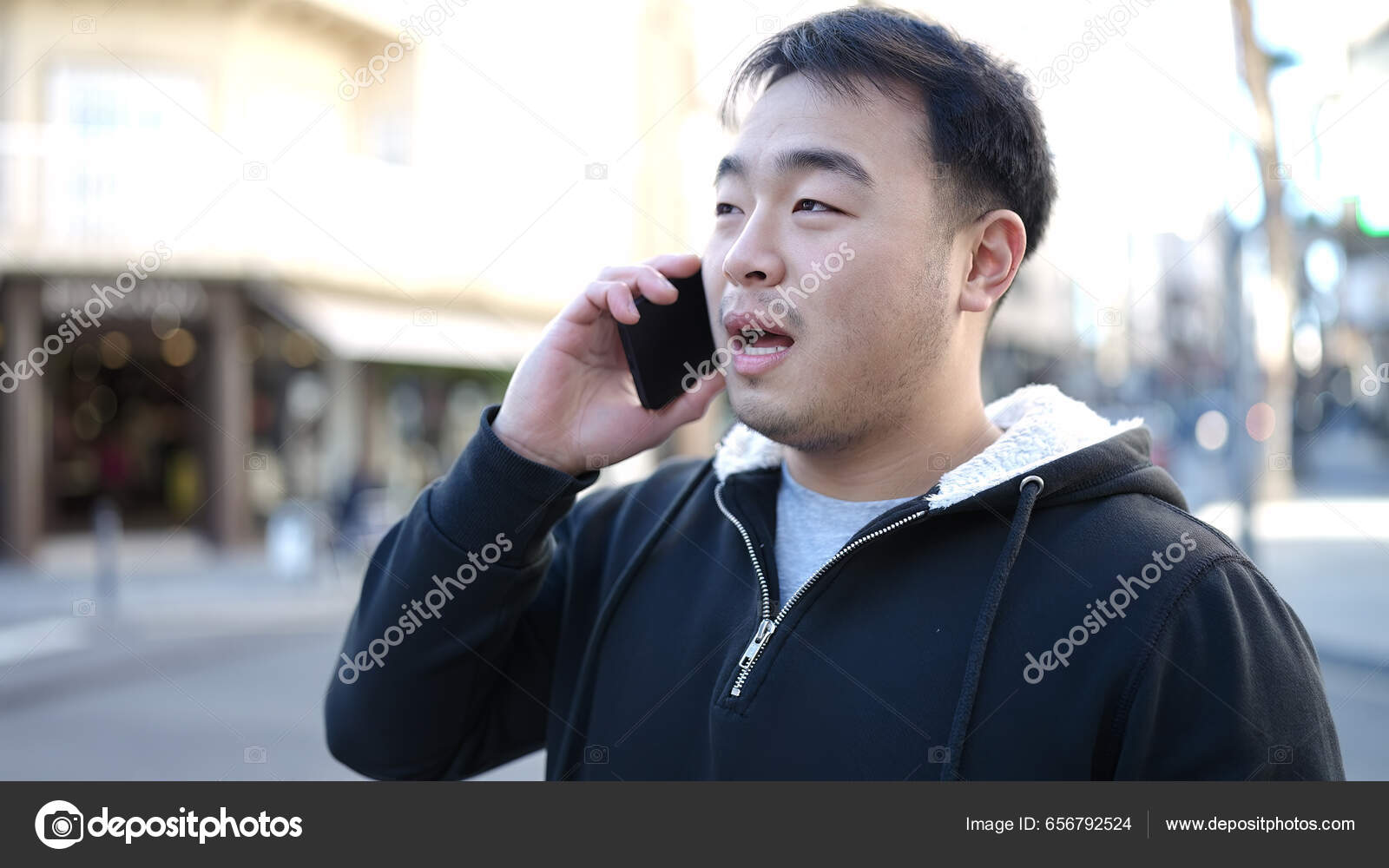 Young Chinese Man Talking Smartphone Serious Expression Street — Stock ...