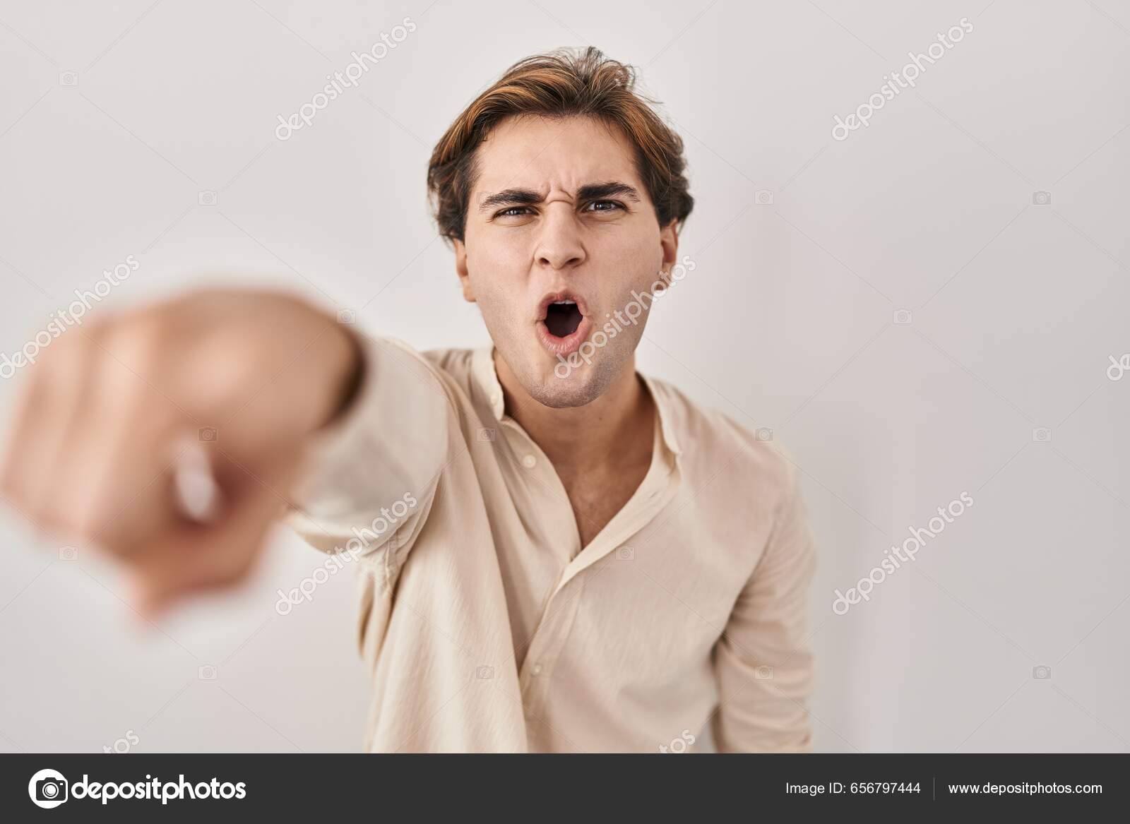 Young Man Standing Isolated Background Pointing Displeased Frustrated ...