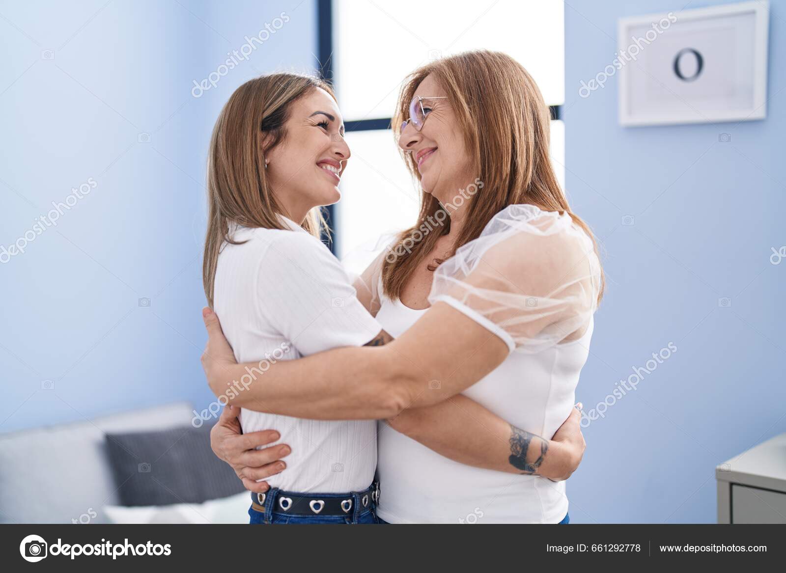 Mother Daughter Hugging Each Other Standing Home — Stock Photo © Krakenimages.com #661292778