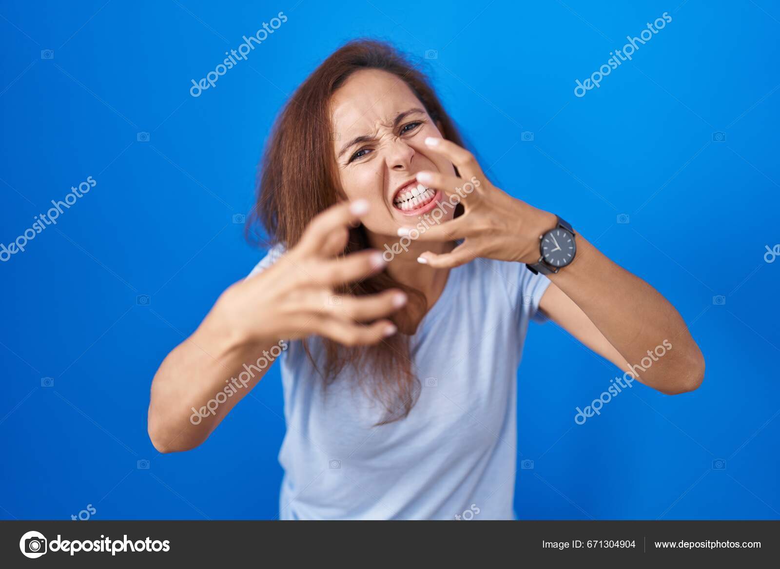 Brunette Woman Standing Blue Background Shouting Frustrated Rage Hands ...