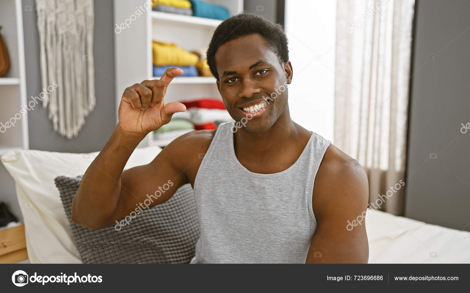 Smiling Man Gestures 'Small' His Fingers Cozy Bedroom Setting — Stock ...