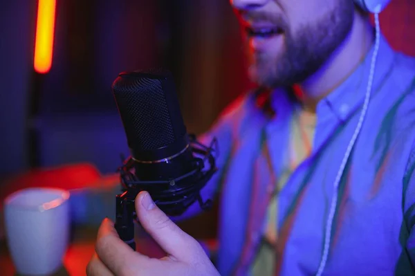 A video blogger records content in his studio. The host of the video ...