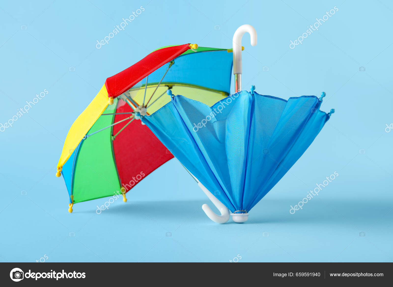 Colorful Mini Umbrellas Blue Background — Stock Photo © serezniy #659591940