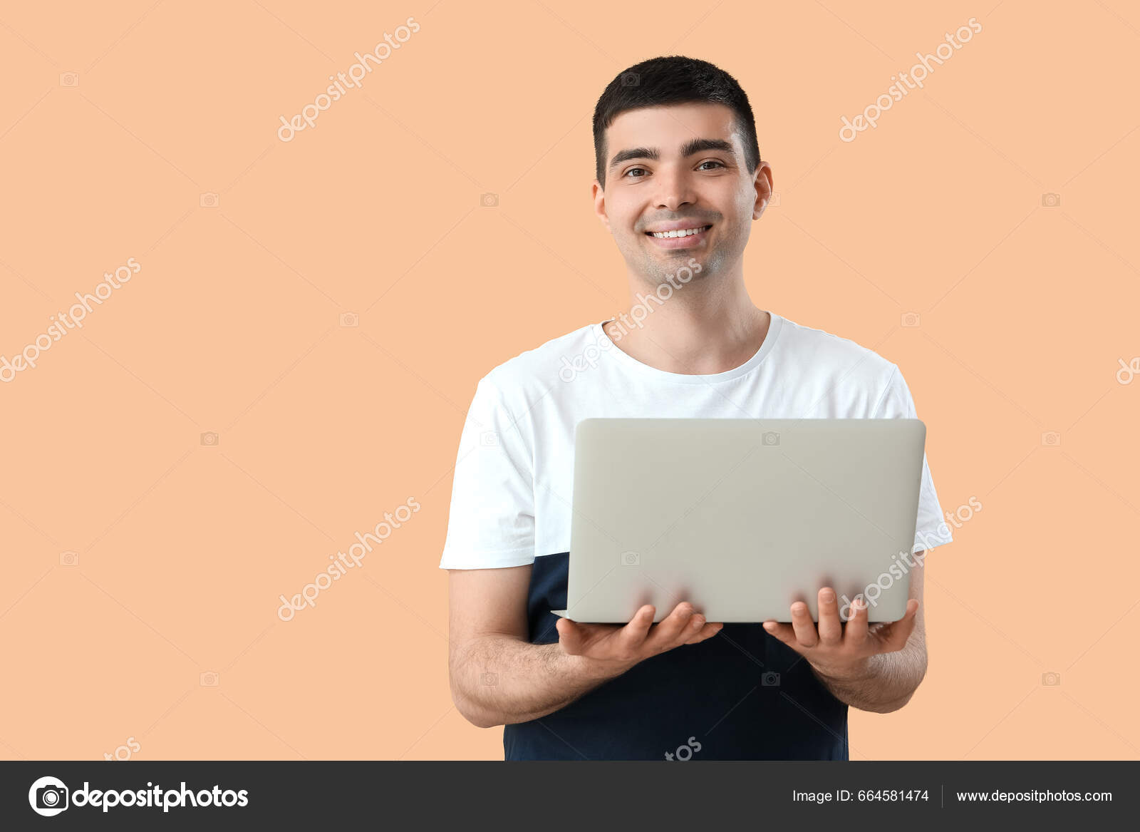 Young Man Laptop Beige Background — Stock Photo © serezniy #664581474