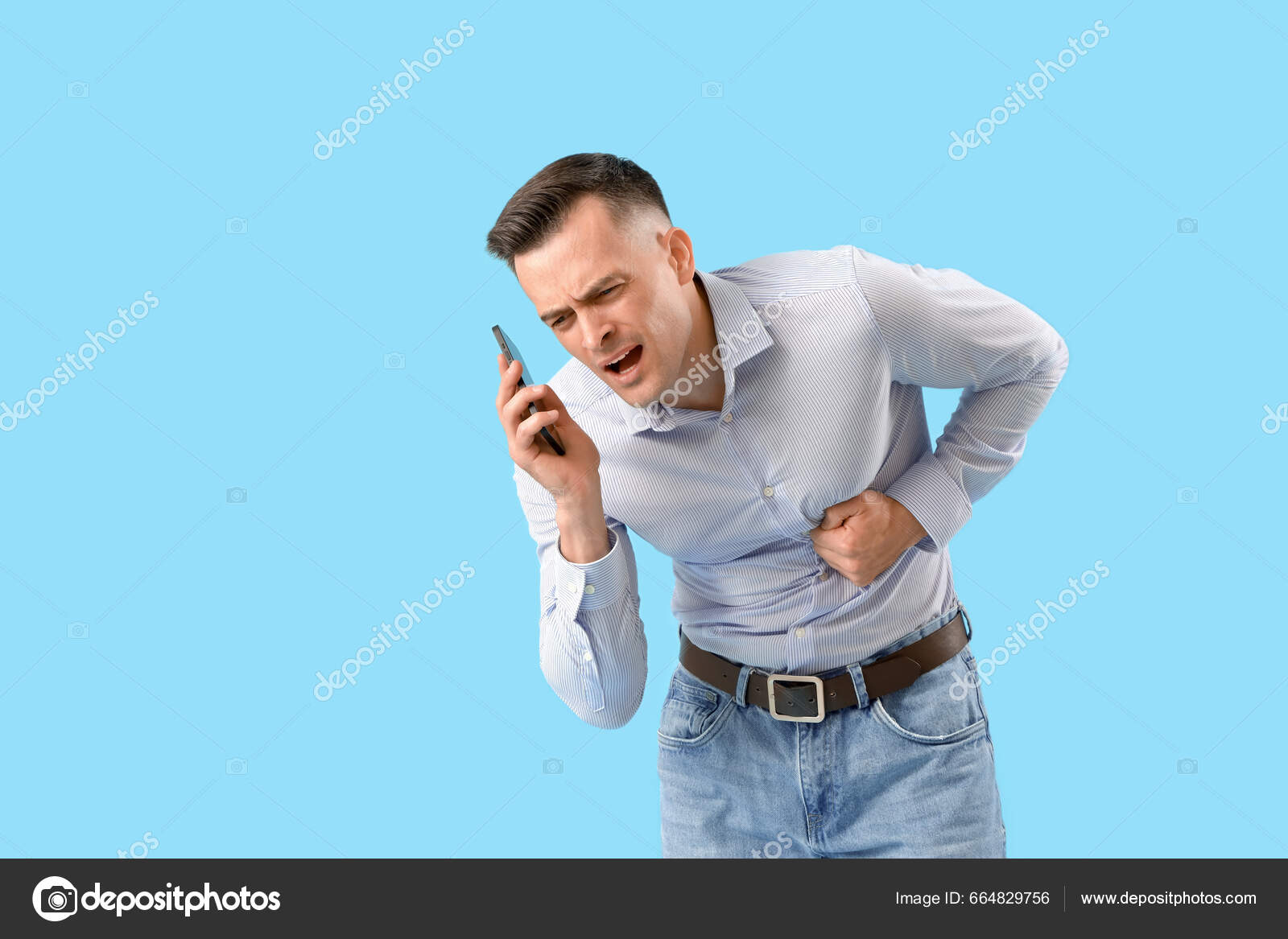 Young Man Having Heart Attack Blue Background — Stock Photo © serezniy ...