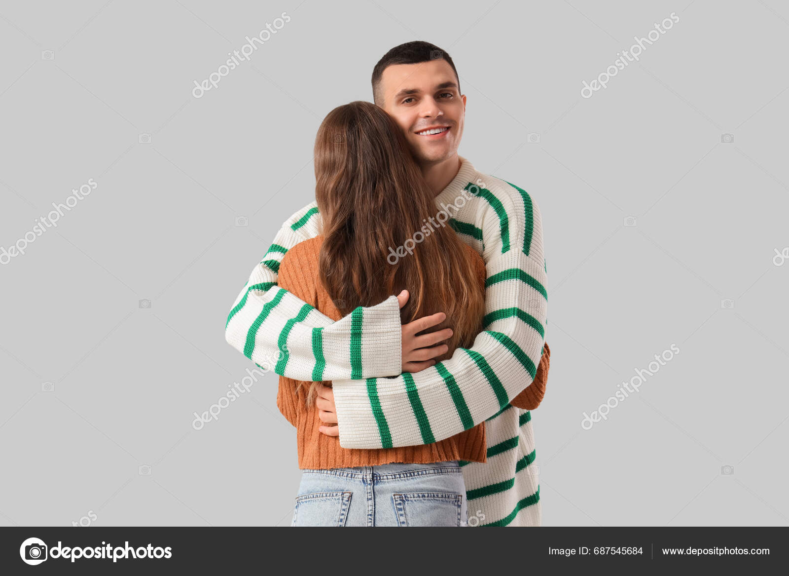 Young Couple Hugging Light Background — Stock Photo © serezniy #687545684
