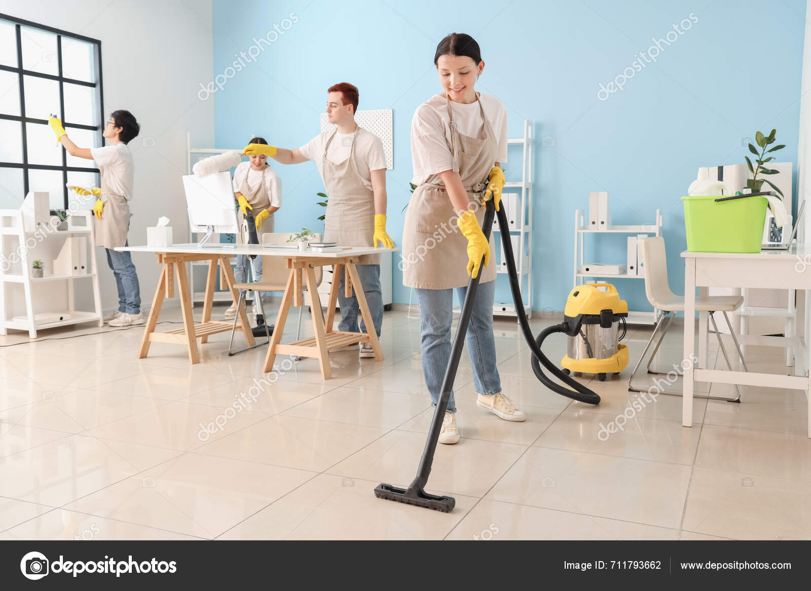 Group Young Janitors Cleaning Office — Stock Photo © serezniy #711793662