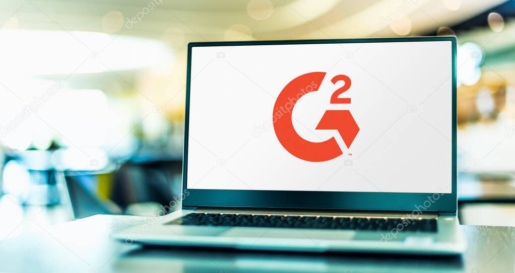 POZNAN, POL - FEB 8, 2023: Laptop computer displaying logo of G2.com, a ...