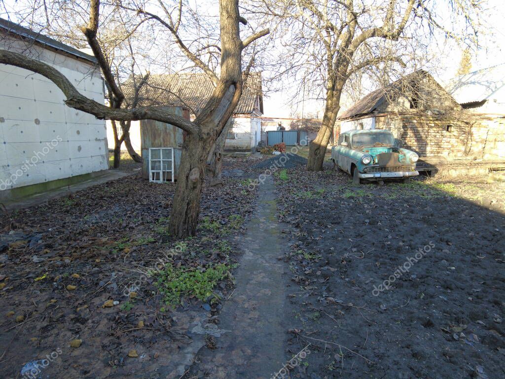 abandoned house in Ukraine. Rubbish in the yard. destroyed house ...