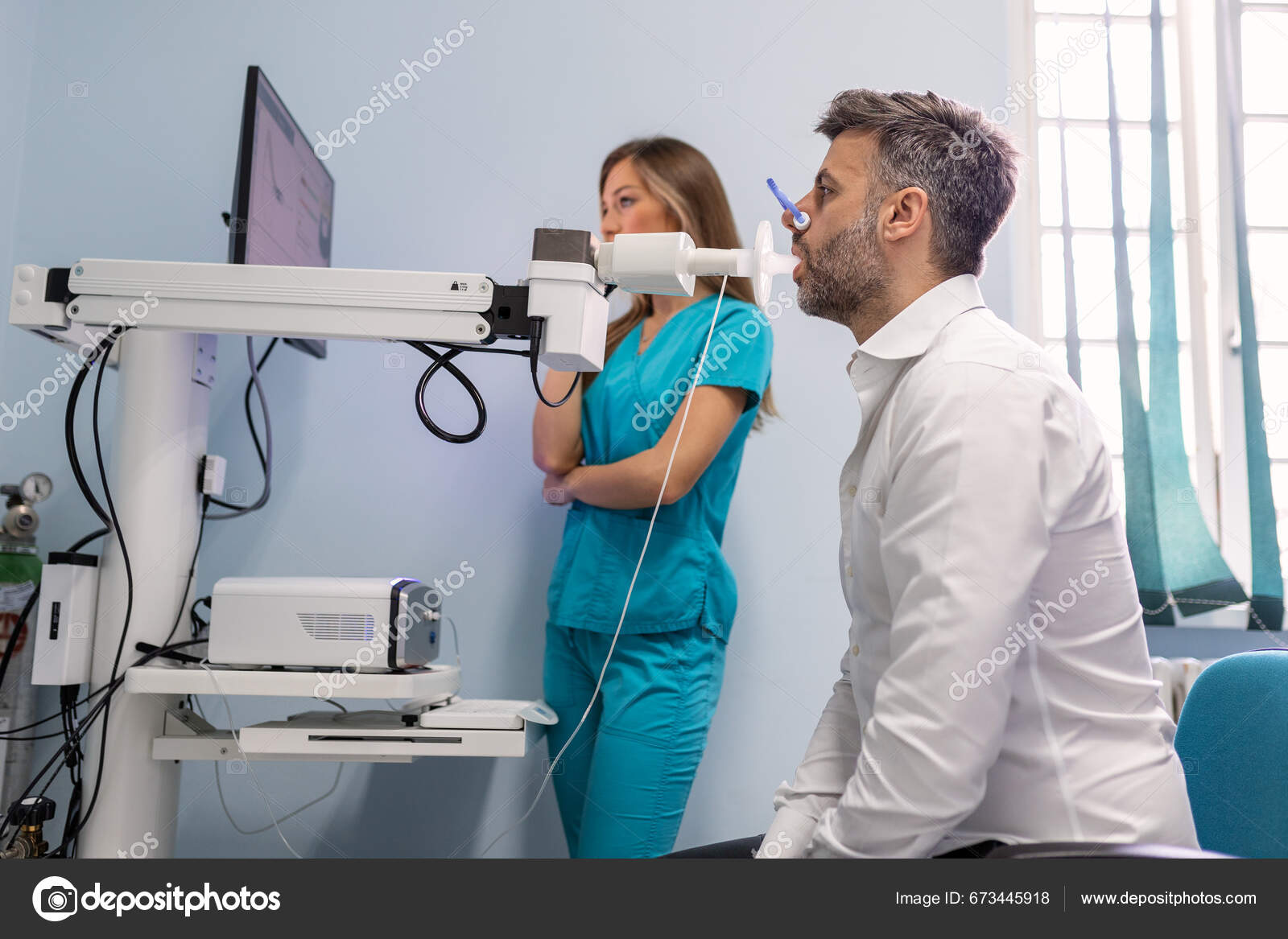 Man Performing Pulmonary Function Test Spirometry Using Spirometer ...
