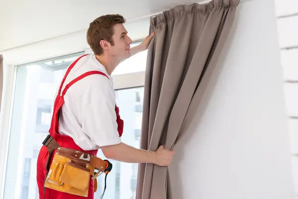 Installing curtain rail Stock Photos, Royalty Free Installing curtain ...