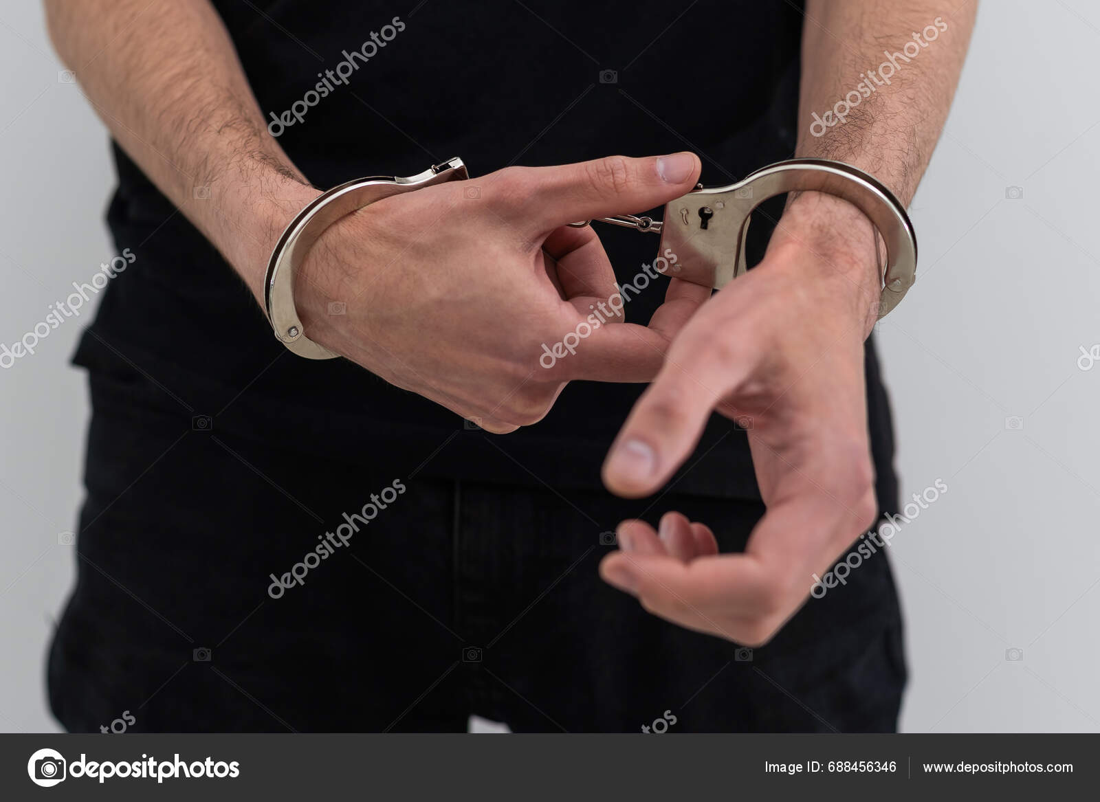 Mens Hands Closed Chrome Handcuffs — Stock Photo © sinenkiy #688456346