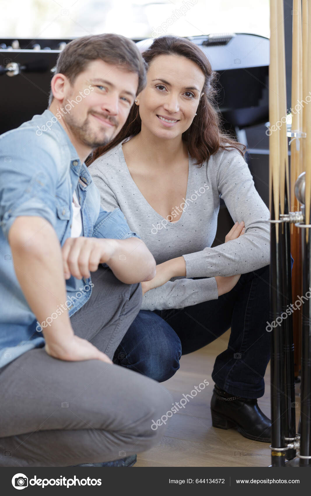 Couple Kneeling Rack Snooker Cues — Stock Photo © photography33 #644134572