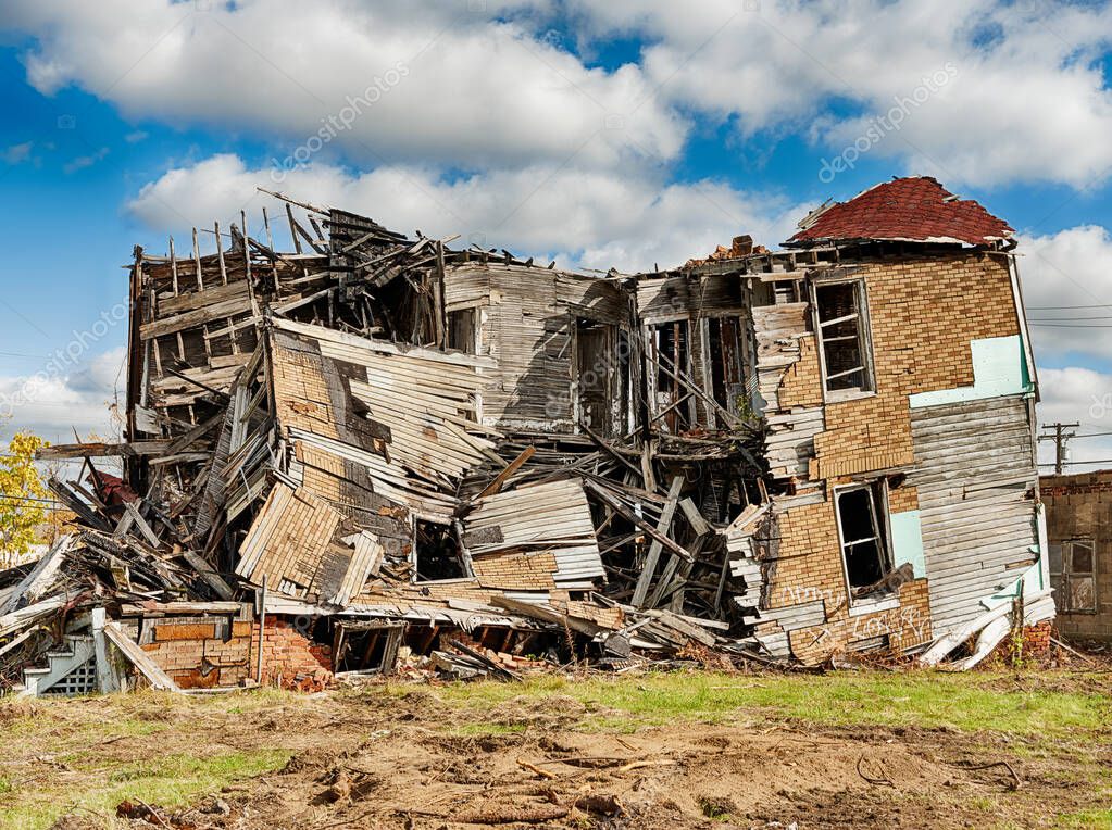 A partially demolished house is being torn down to make way for a new ...
