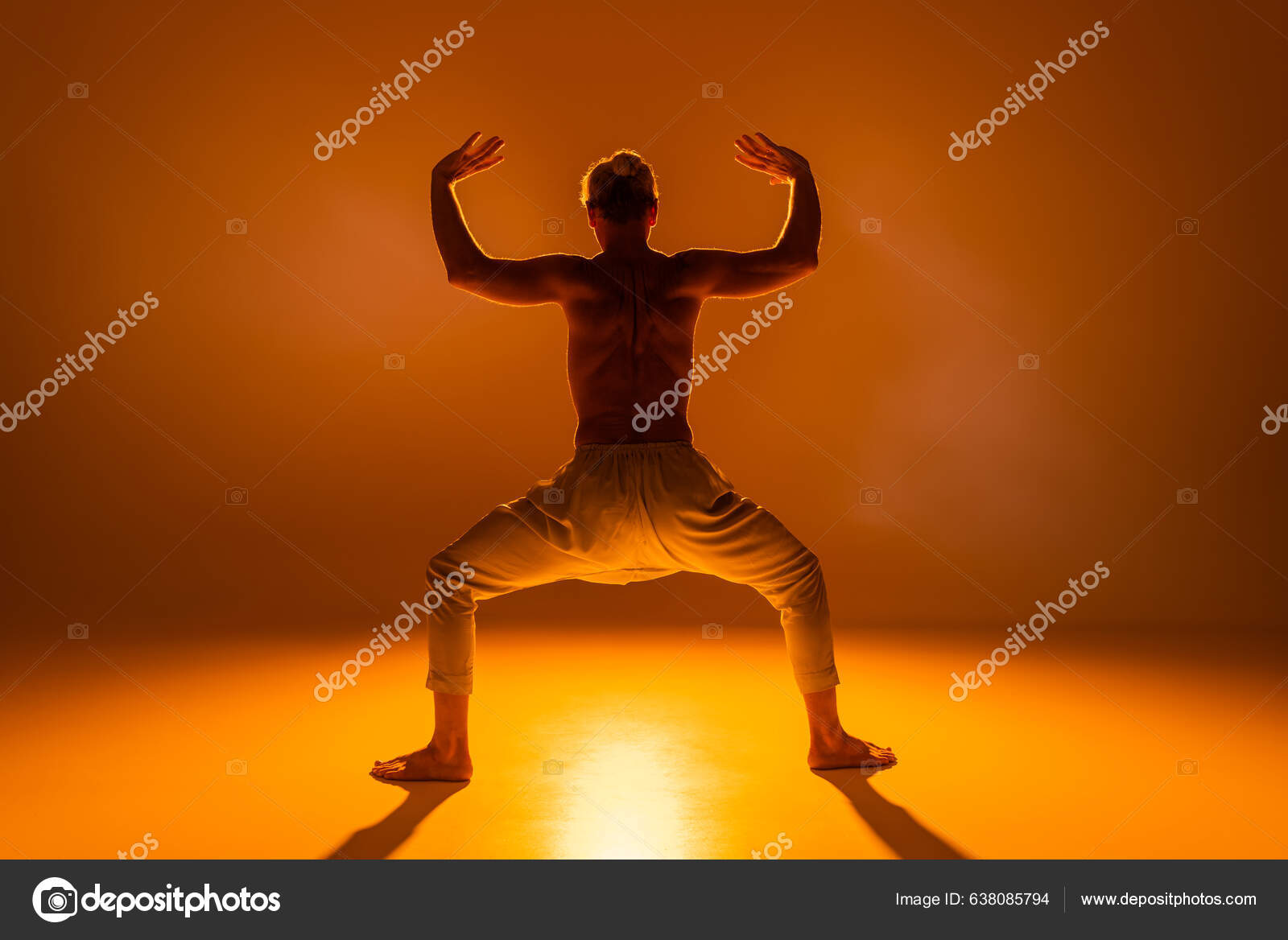 Back View Shirtless Man Practicing Goddess Yoga Pose Orange Background ...