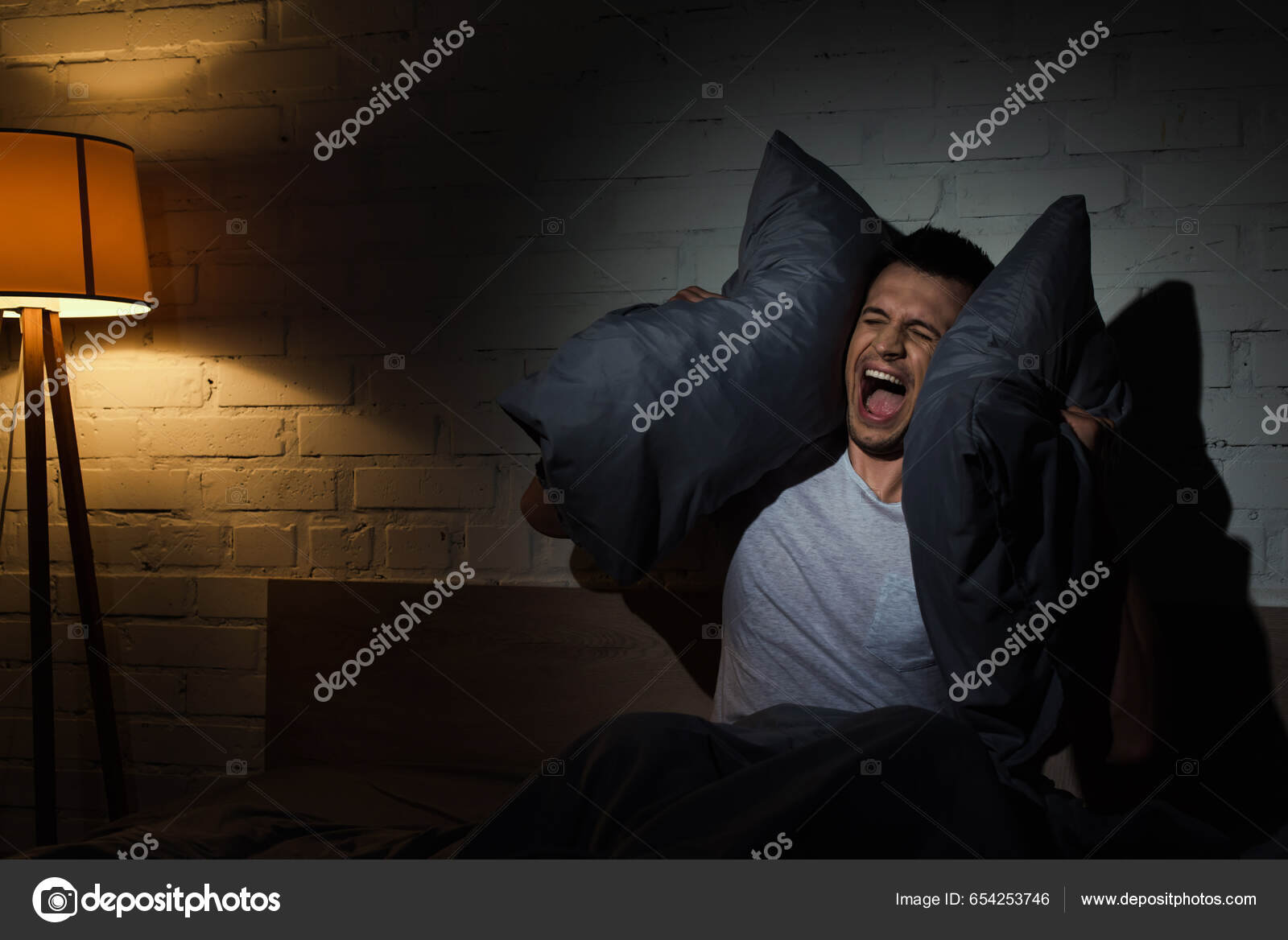 Scared Young Man Screaming While Having Nightmares Covering Ears ...