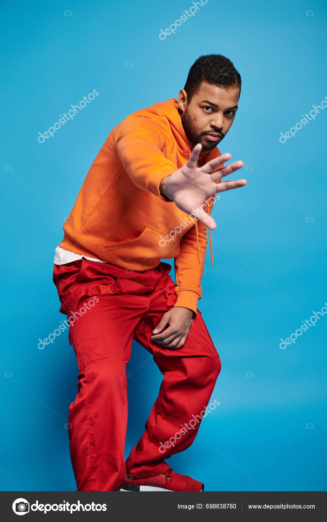 Attractive African American Man Vibrant Outfit Hiding Camera Hand Blue ...