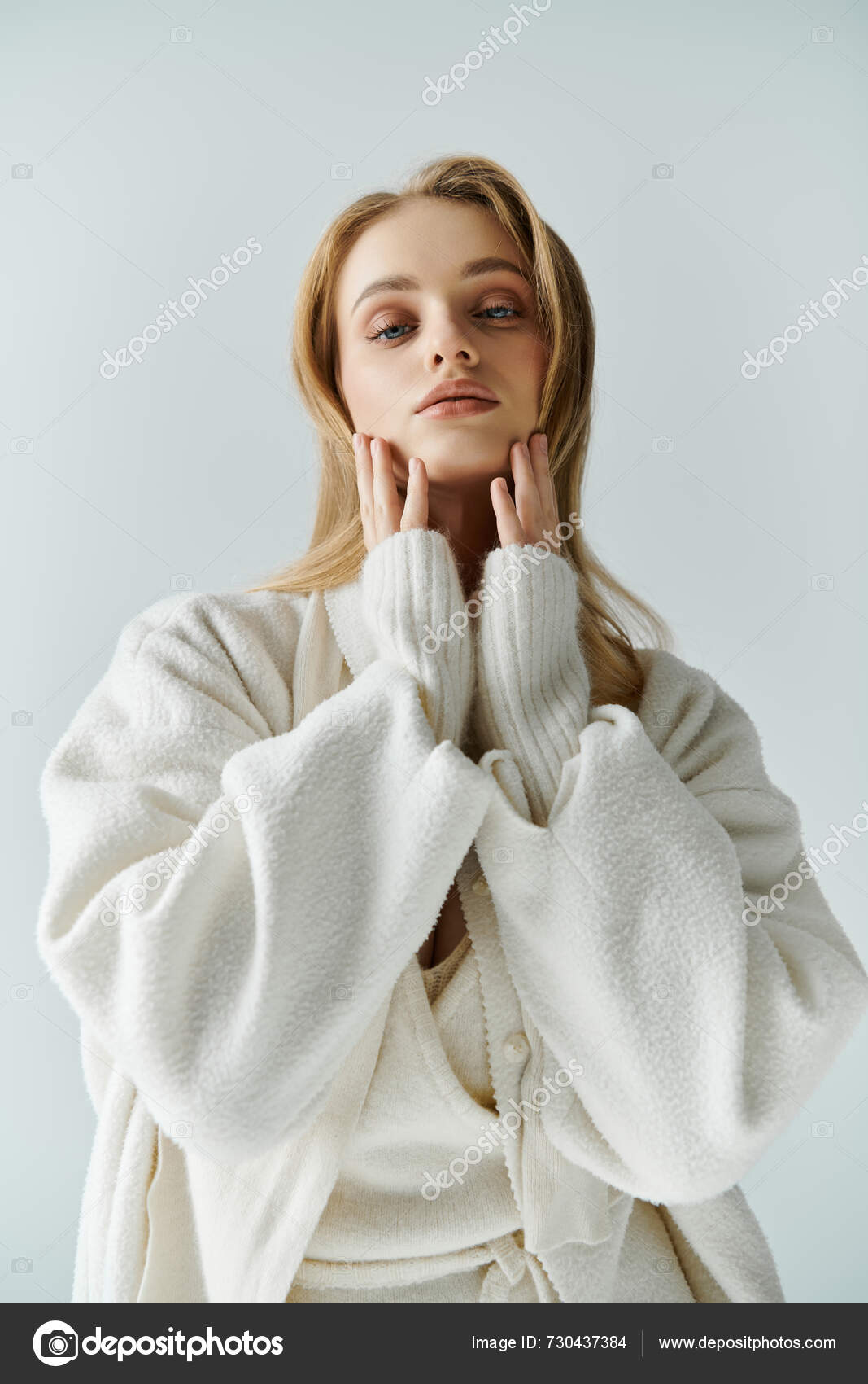 Young Woman White Sweater Poses Delicately Her Hands Resting Her ...