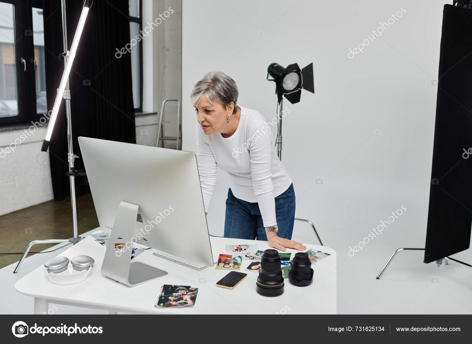 Woman Leans Computer Photo Studio Reviewing Images Serious Expression ...