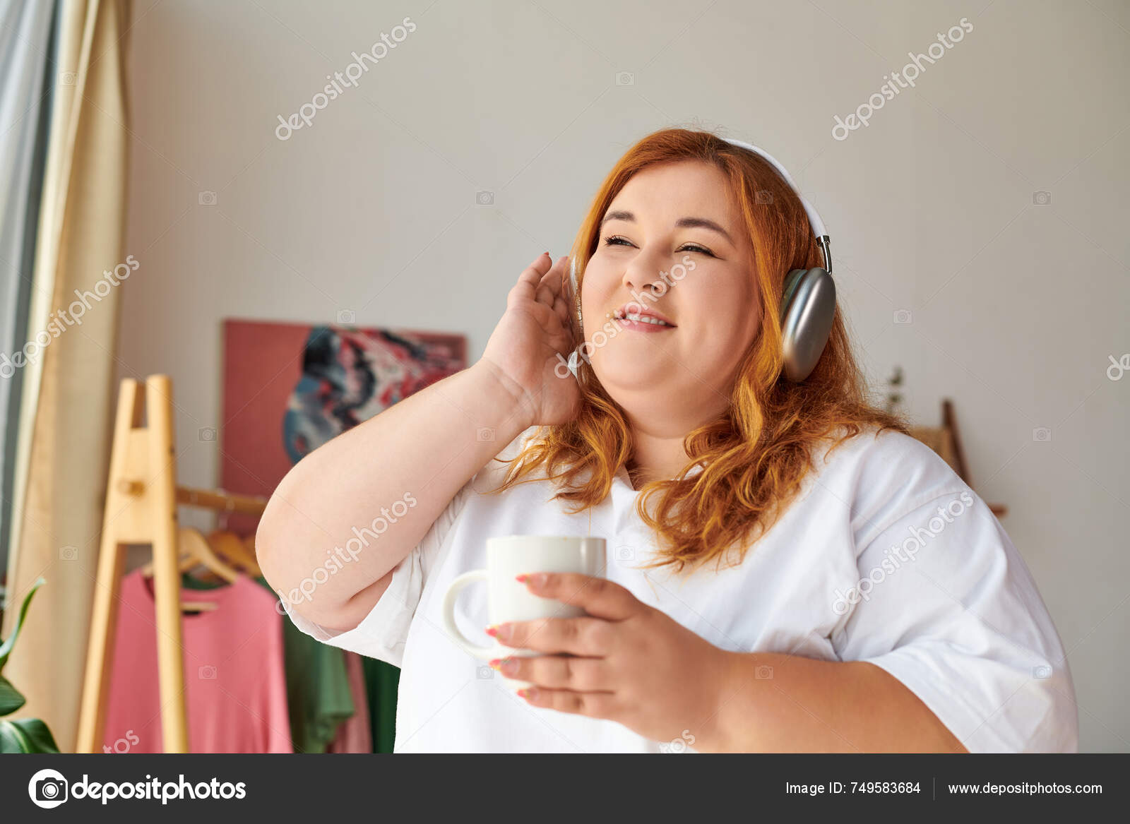 Beautiful Size Woman Relishes Her Favorite Tunes While Sipping Coffee ...