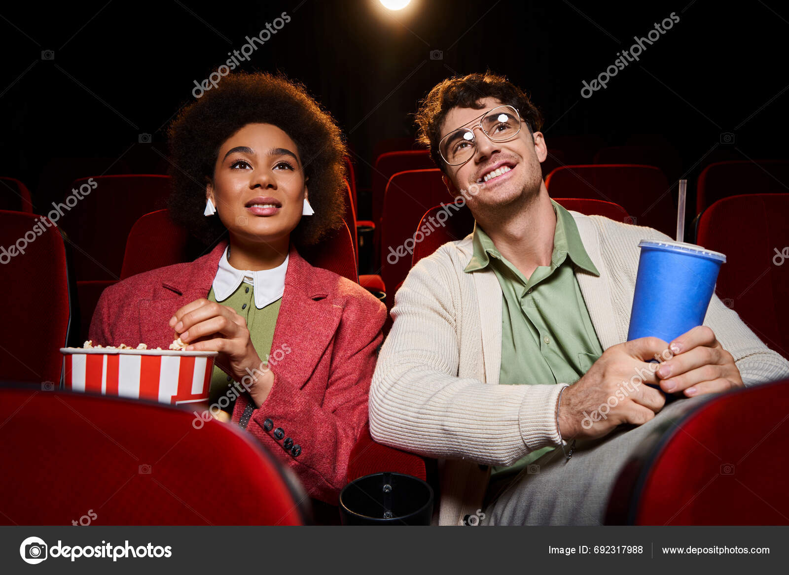 Jolly Multicultural Couple Retro Stylish Clothes Watching Movie ... Jolly Multicultural Couple Retro Stylish Clothes Watching Movie ...
