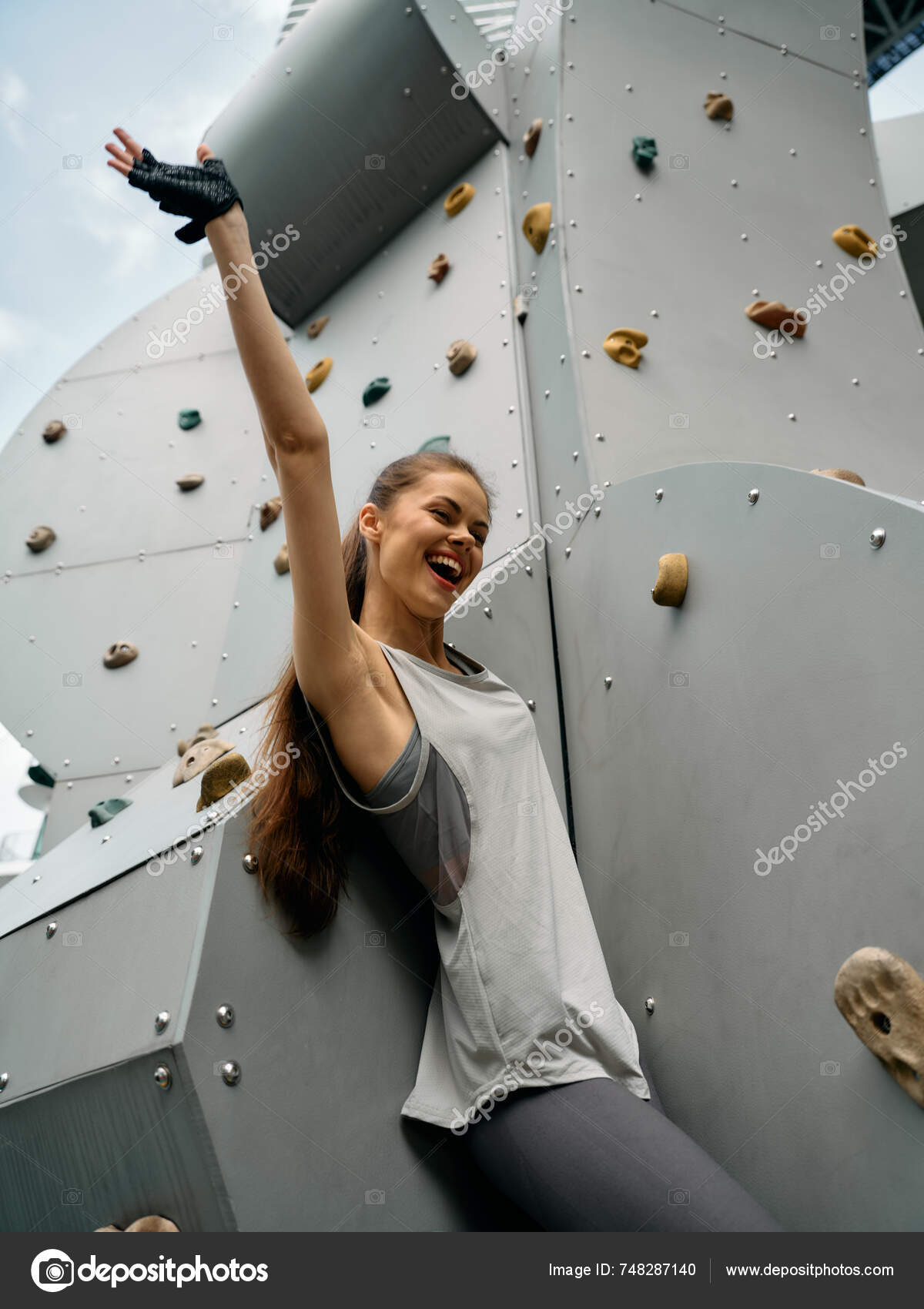 Joyful Female Athlete Activewear Poses Climbing Wall Displaying ...