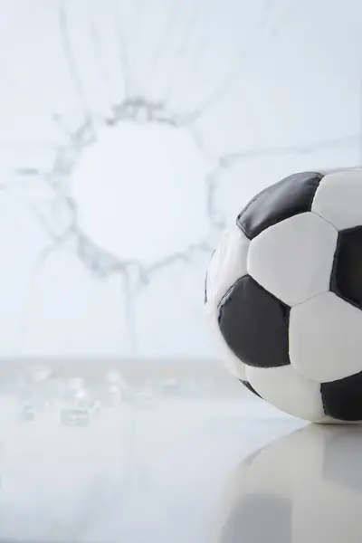 Broken glass with football Stock Photos, Royalty Free Broken glass with ...