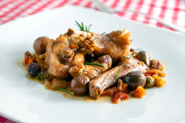 Dish of delicious rabbit meat alla cacciatora, typical recipe of ...