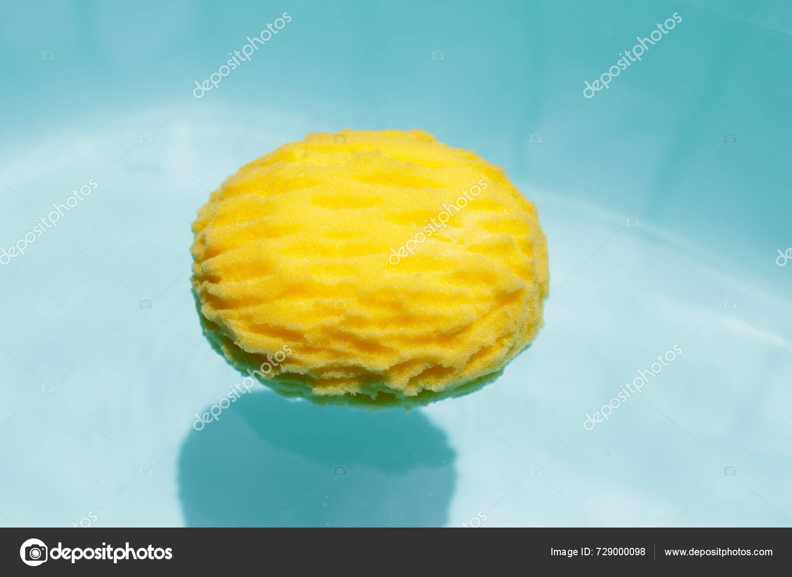 Yellow Bath Sponge Floating Blue Water — Stock Photo © Bowonpat #729000098