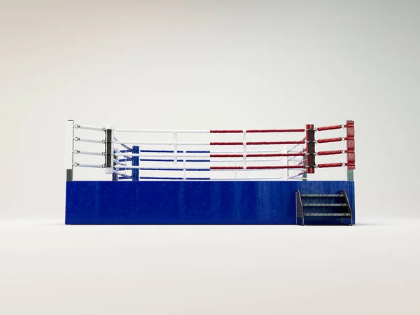 A modern regulation sized boxing ring with opposing blue and red ...