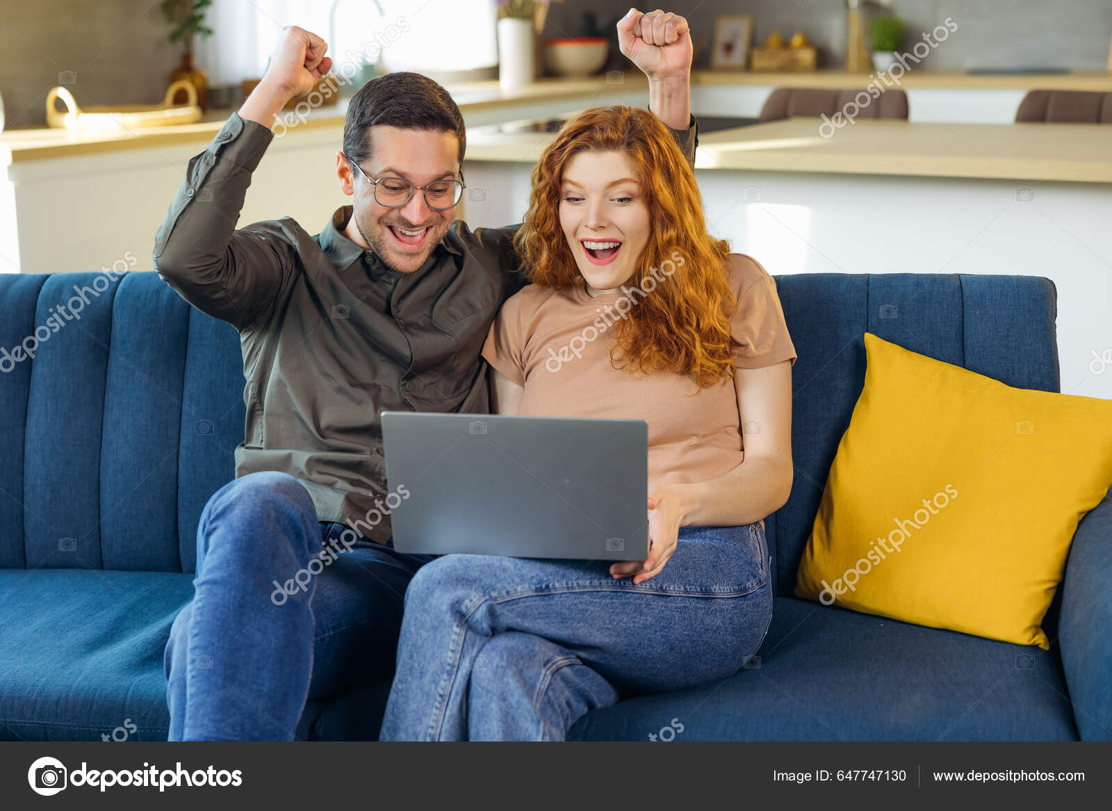 Shocked Young Family Couple Cuddle Sofa Raise Hands Scream Wow Stock ...
