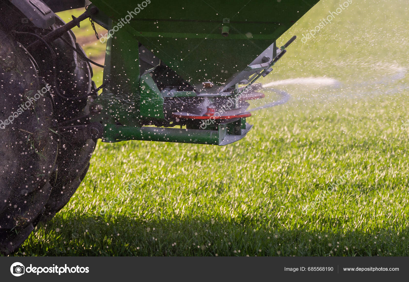 Tractor Fertilizing Wheat Field — Stock Photo © fotokostic #685568190