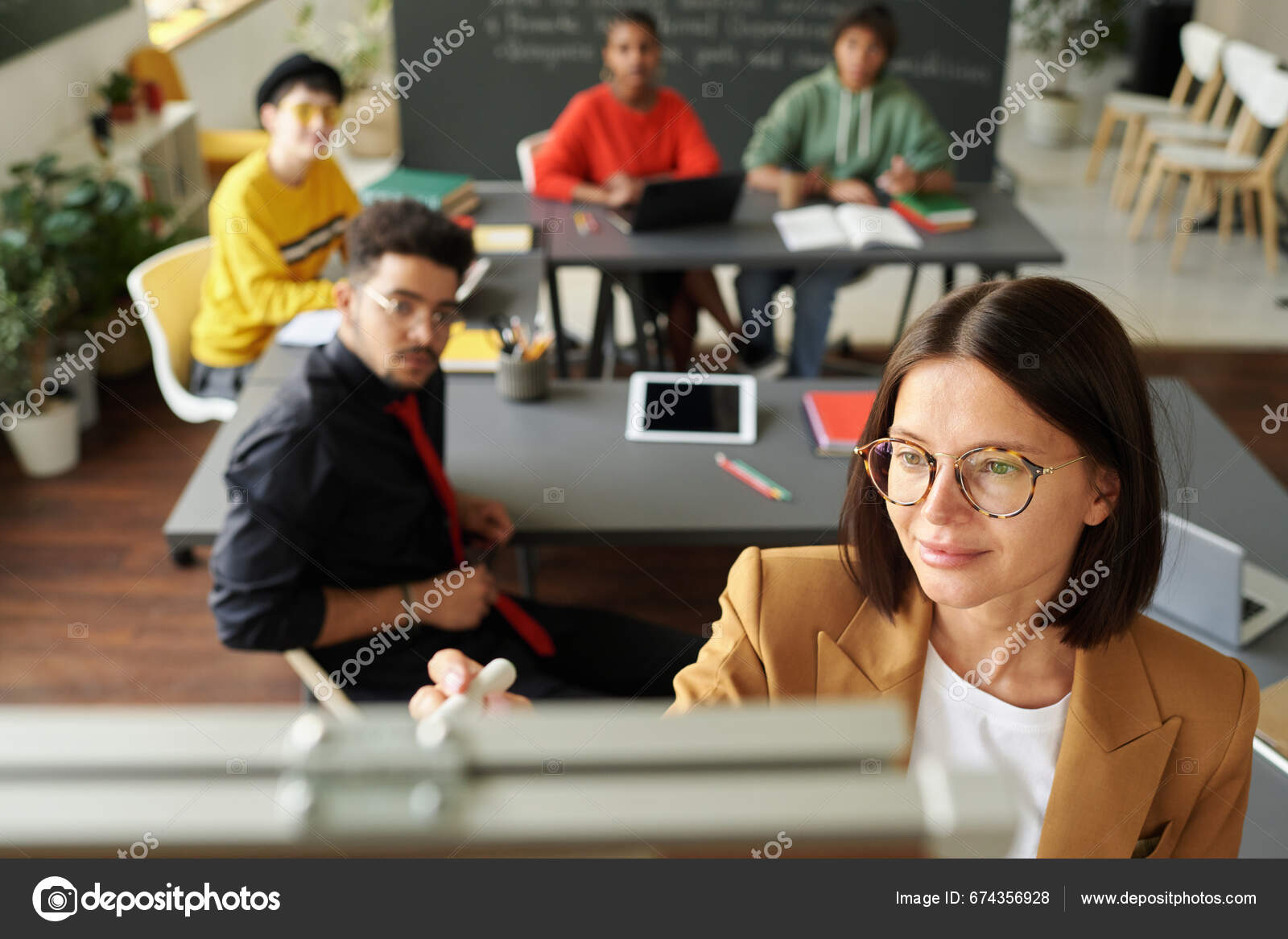 Young Teacher Writing Blackboard While Having Lesson Students Class ...