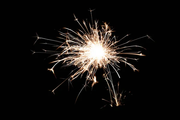 Sparkling burning sparkler on a black background. Isolated burning ...